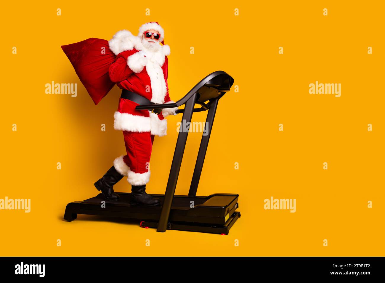 Full length photo of cool cheerful holly jolly character santa going on ...