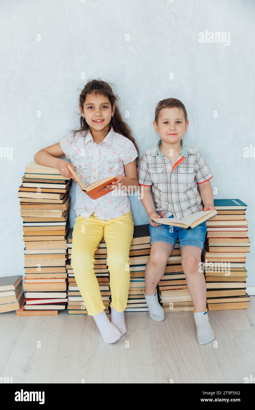 Cartoon boy reading on stack hi-res stock photography and images - Alamy