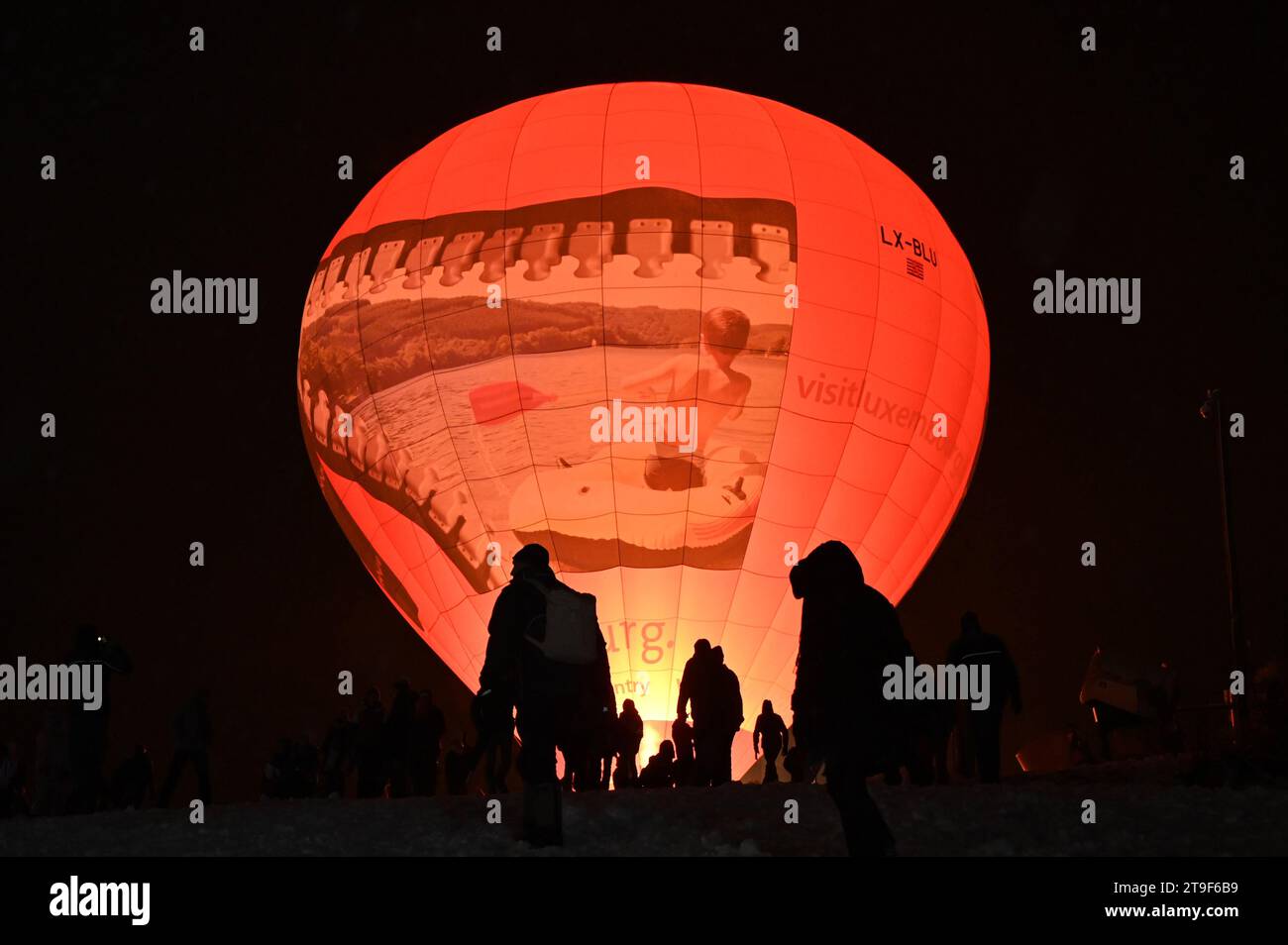 At the night of the balloons, the balloonists fire their balloons on ...