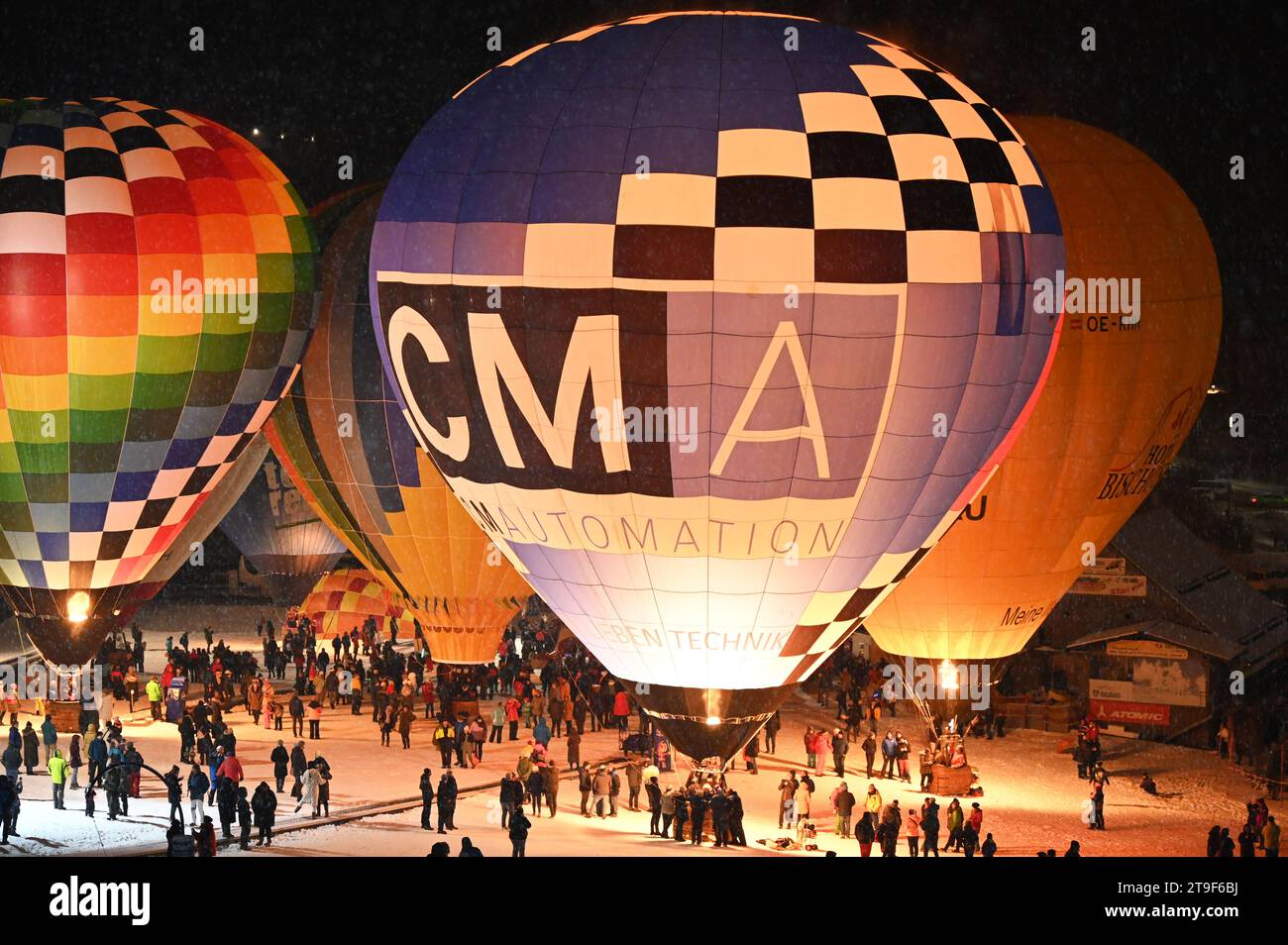 At the night of the balloons, the balloonists fire their balloons on ...