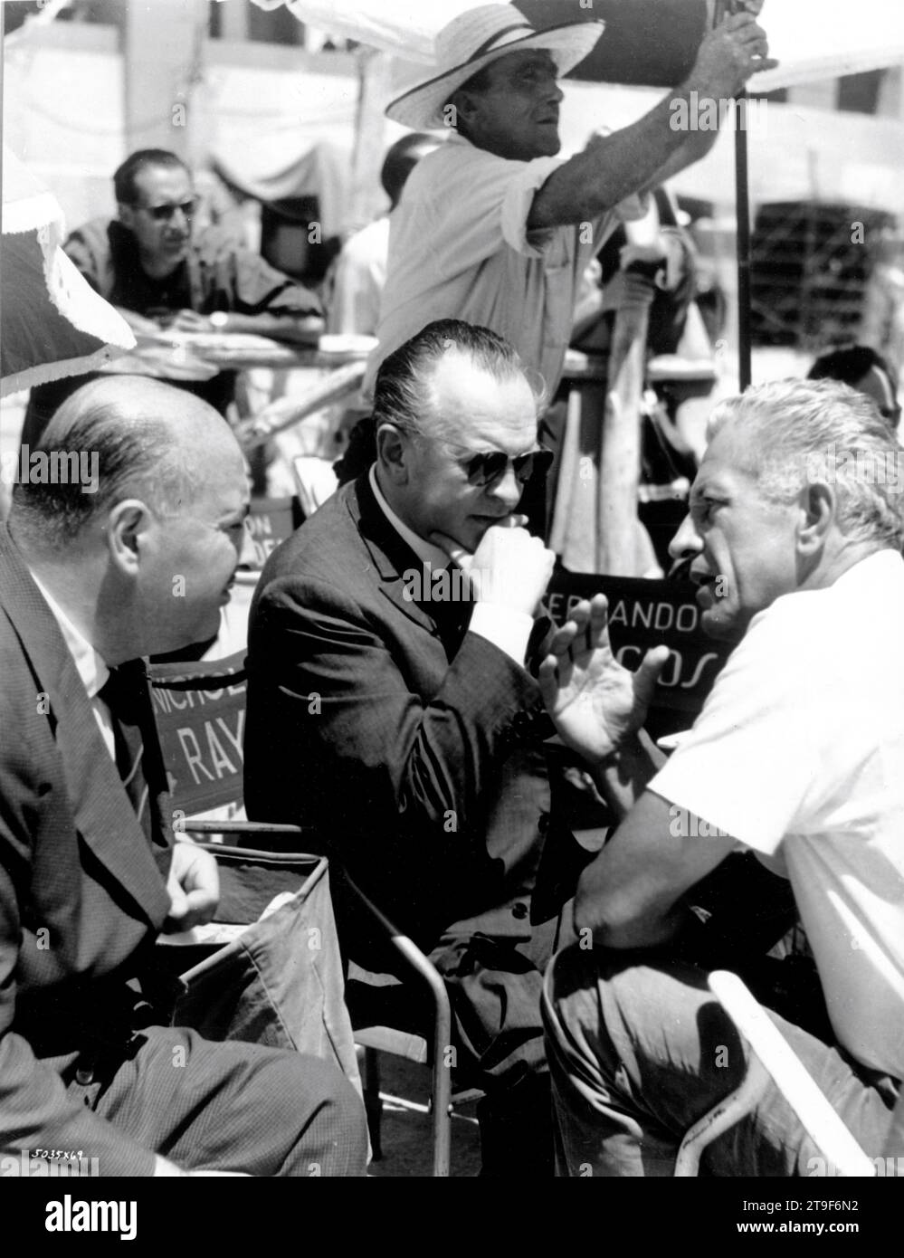 Producer SAMUEL BRONSTON (centre) and Director NICHOLAS RAY on set ...