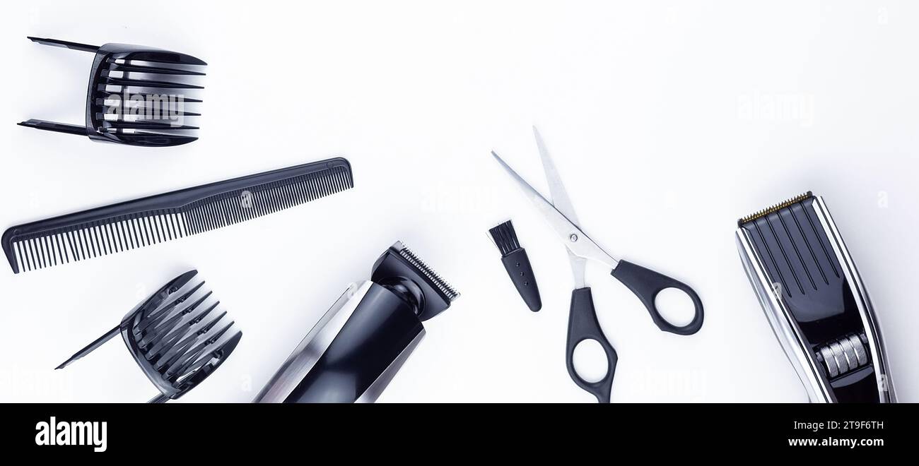 machine for haircuts. On the table are scissors and a comb. Barbershop ...