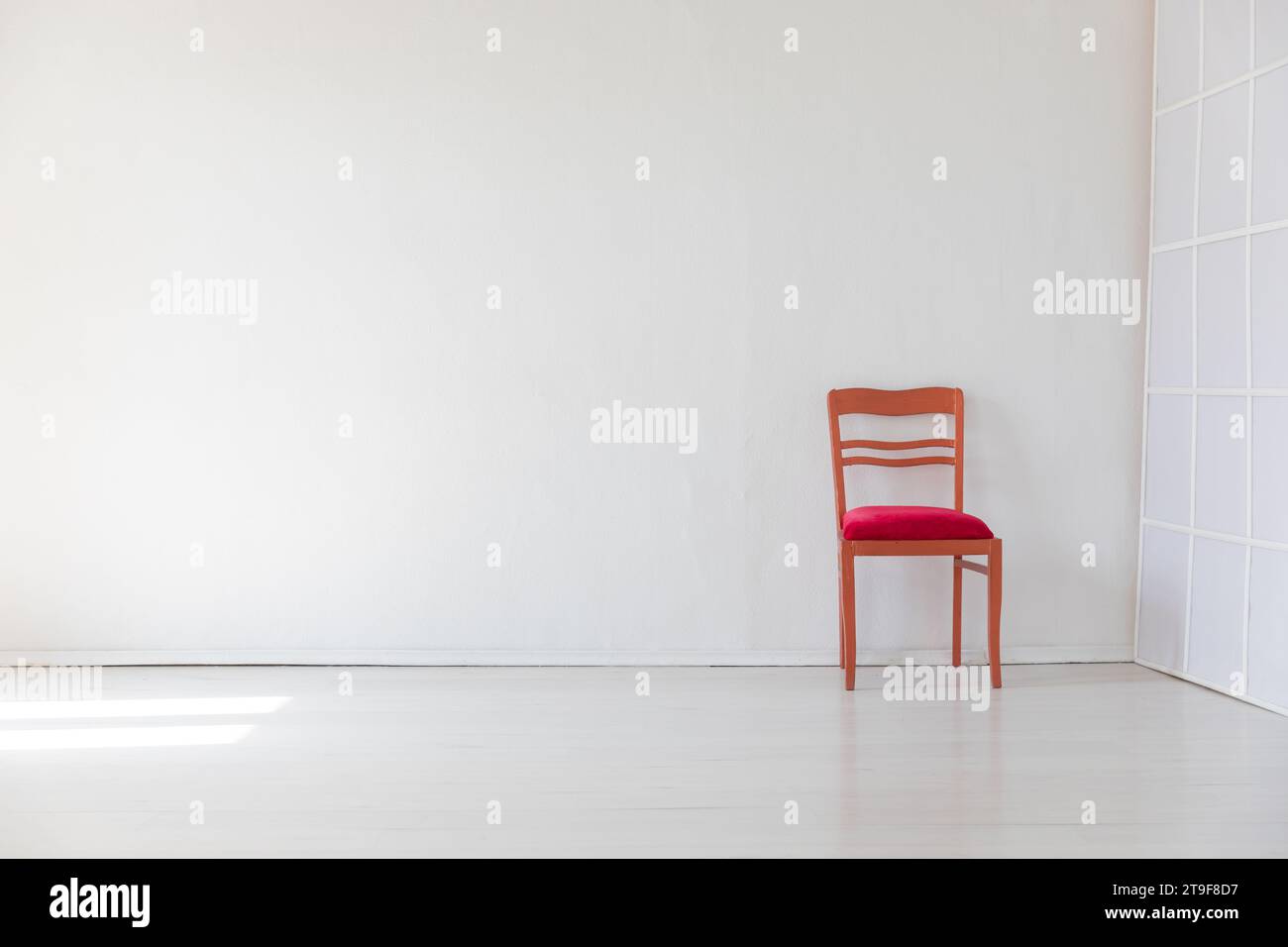 red vintage chair in white room interior Stock Photo - Alamy