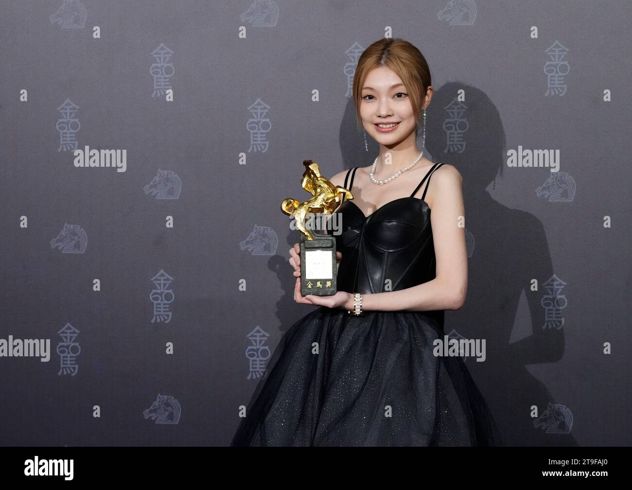 Hong Kong actress Yoyo Tse holds her award for Best New Performer at ...
