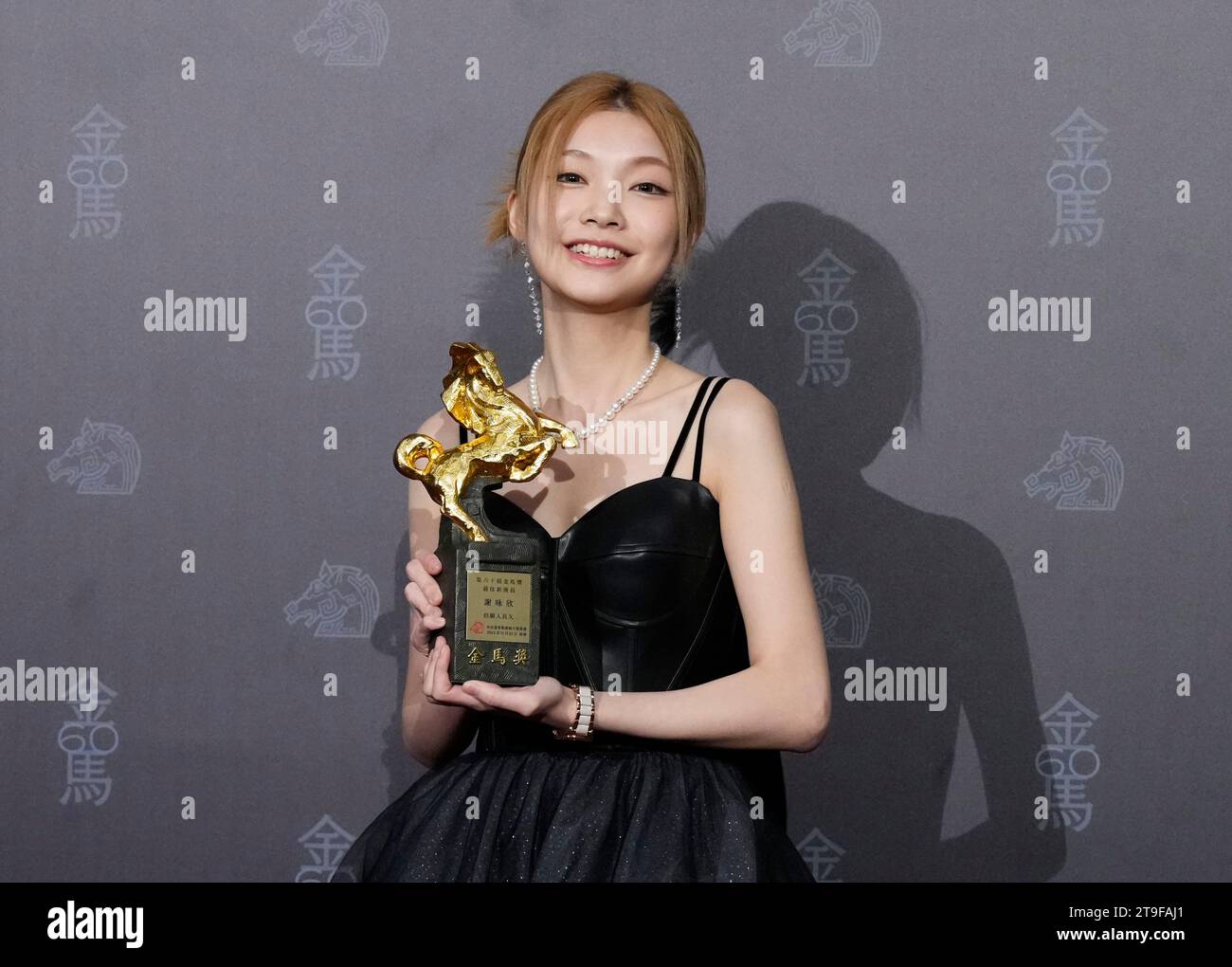 Hong Kong actress Yoyo Tse holds her award for Best New Performer at ...
