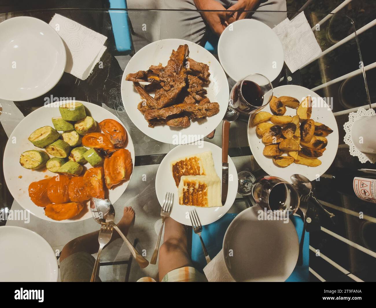 top view of the table with dinner. BBQ meat, grilled vegetables ...