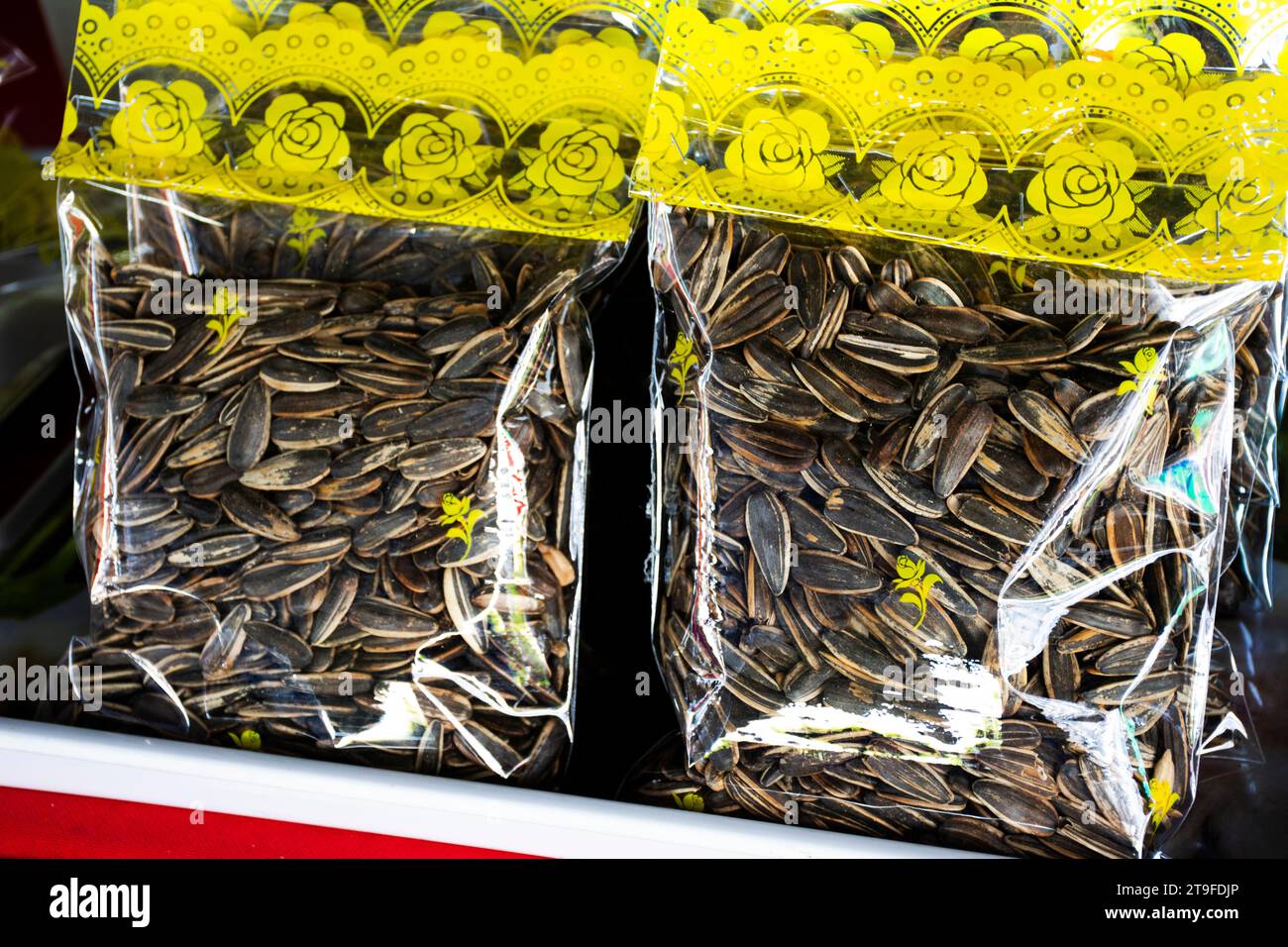 Thai people cooking local food baked sunflowers seeds with shell for ...
