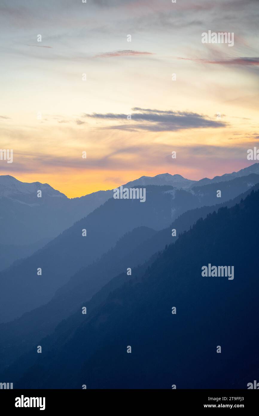 Orange blue hues of Himalaya mountains from shimla showing the serenity ...