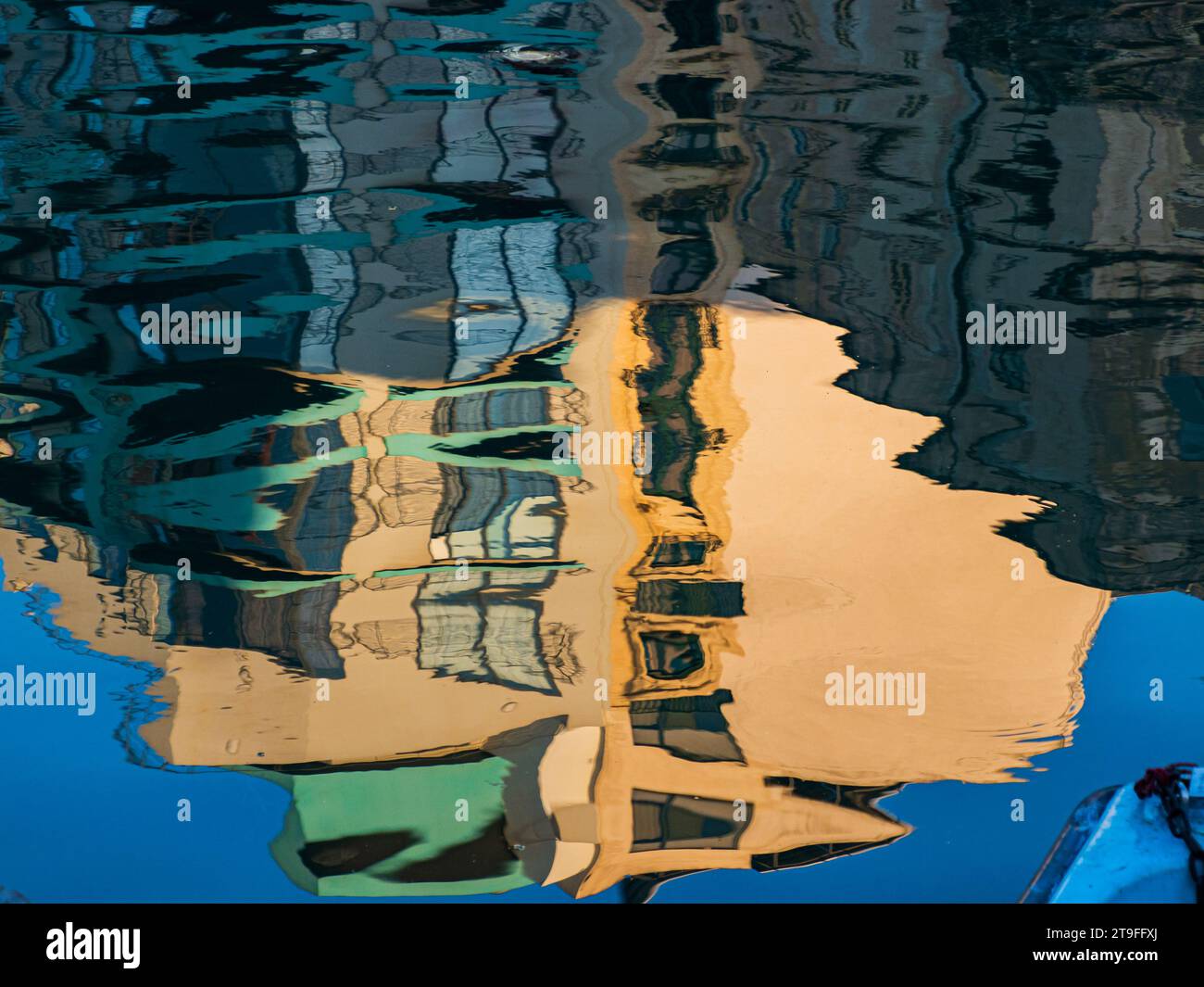 Background. Texture. Abstraction. Reflections of colorful buildings in ...