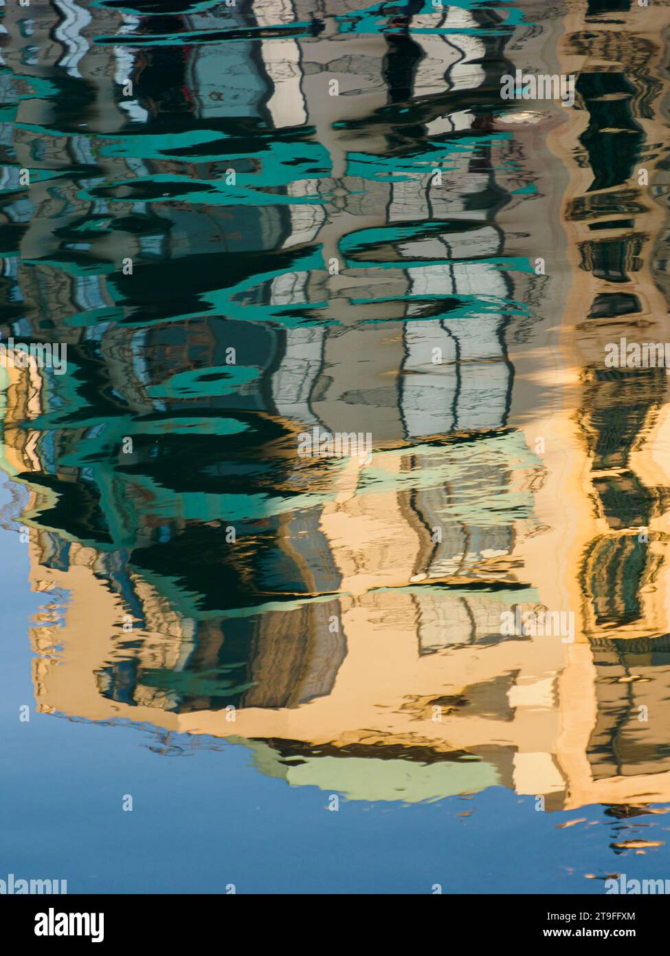 Background. Texture. Abstraction. Reflections of colorful buildings in ...
