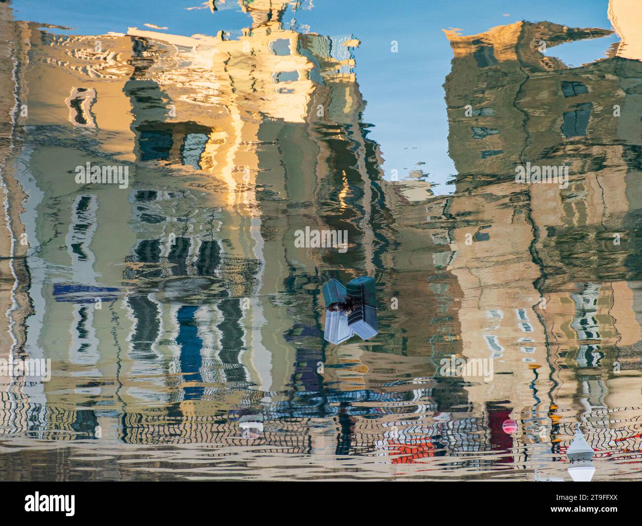 Background. Texture. Abstraction. Reflections of colorful buildings in ...