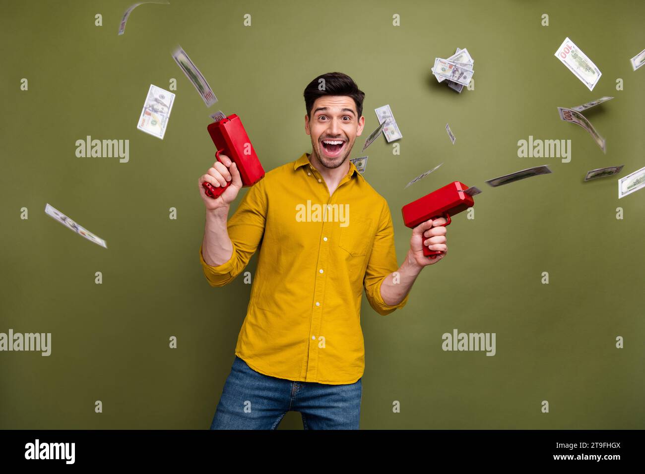 Photo of cheerful crazy funky guy wear yellow stylish clothes hundreds ...