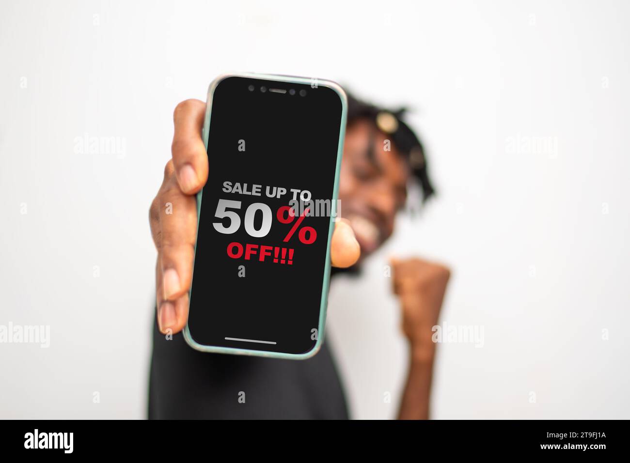 Design sale 50% discount. Man hand holding smartphone with discount ...