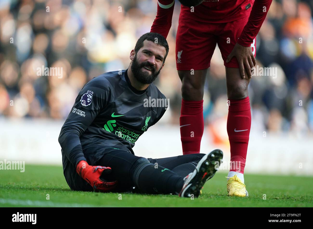 Liverpool goalkeeper Alisson Becker sits injured during the Premier ...