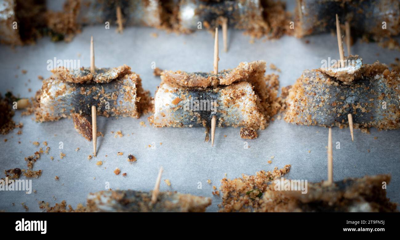 Baked rolled sardines with pine nut dressing, breadcrumbs, raisins ...