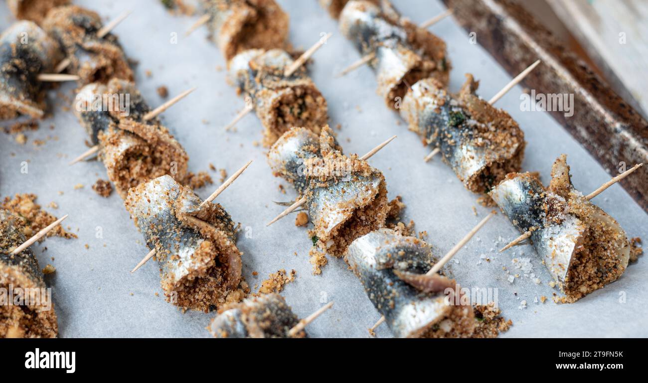 Baked rolled sardines with pine nut dressing, breadcrumbs, raisins ...
