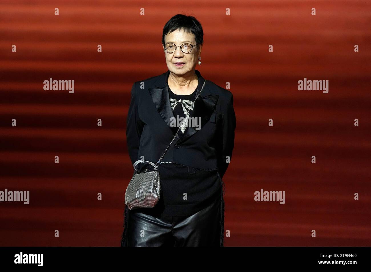 Hong Kong filmmaker and director Ann Hui arrives at the 60th Golden ...