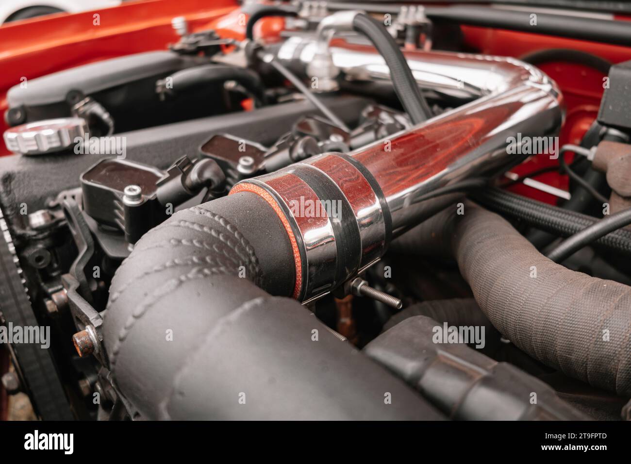 Detail of the engine of a restored car on display at a vintage car fair ...