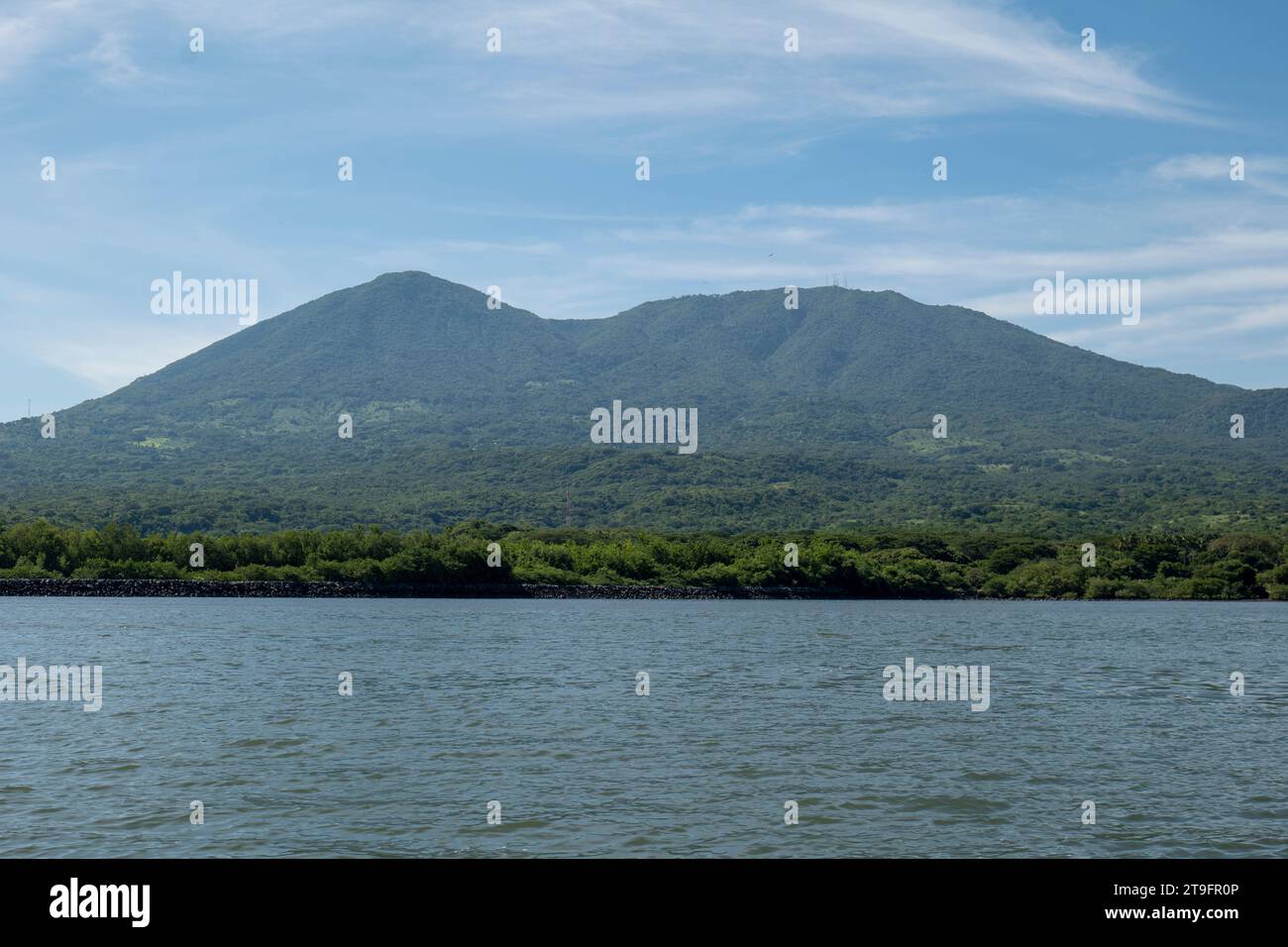 Coastline Seen From Afar with a Volcanic Mountain, Lush Vegetation ...