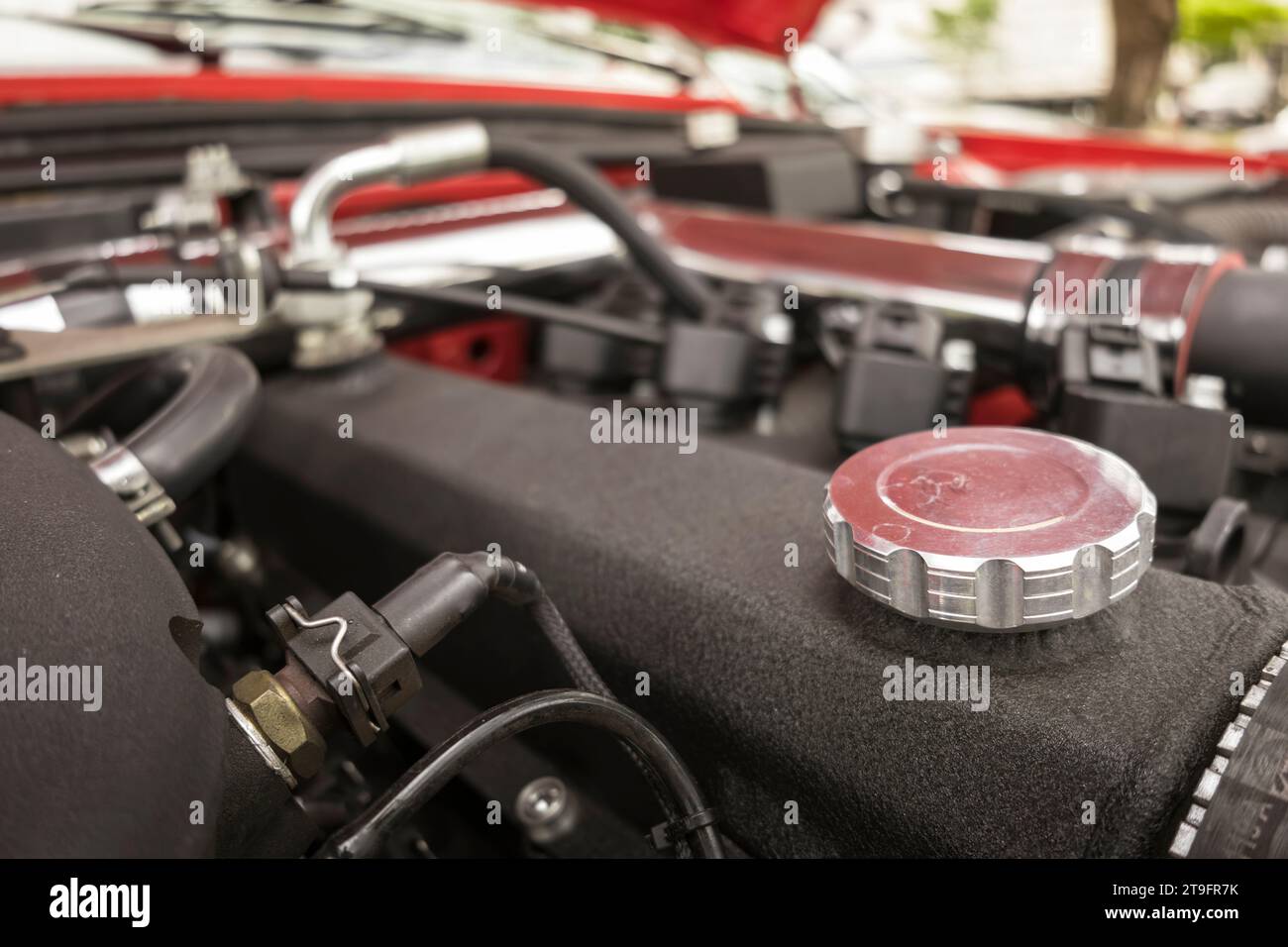 Detail of the engine of a restored car on display at a vintage car fair ...