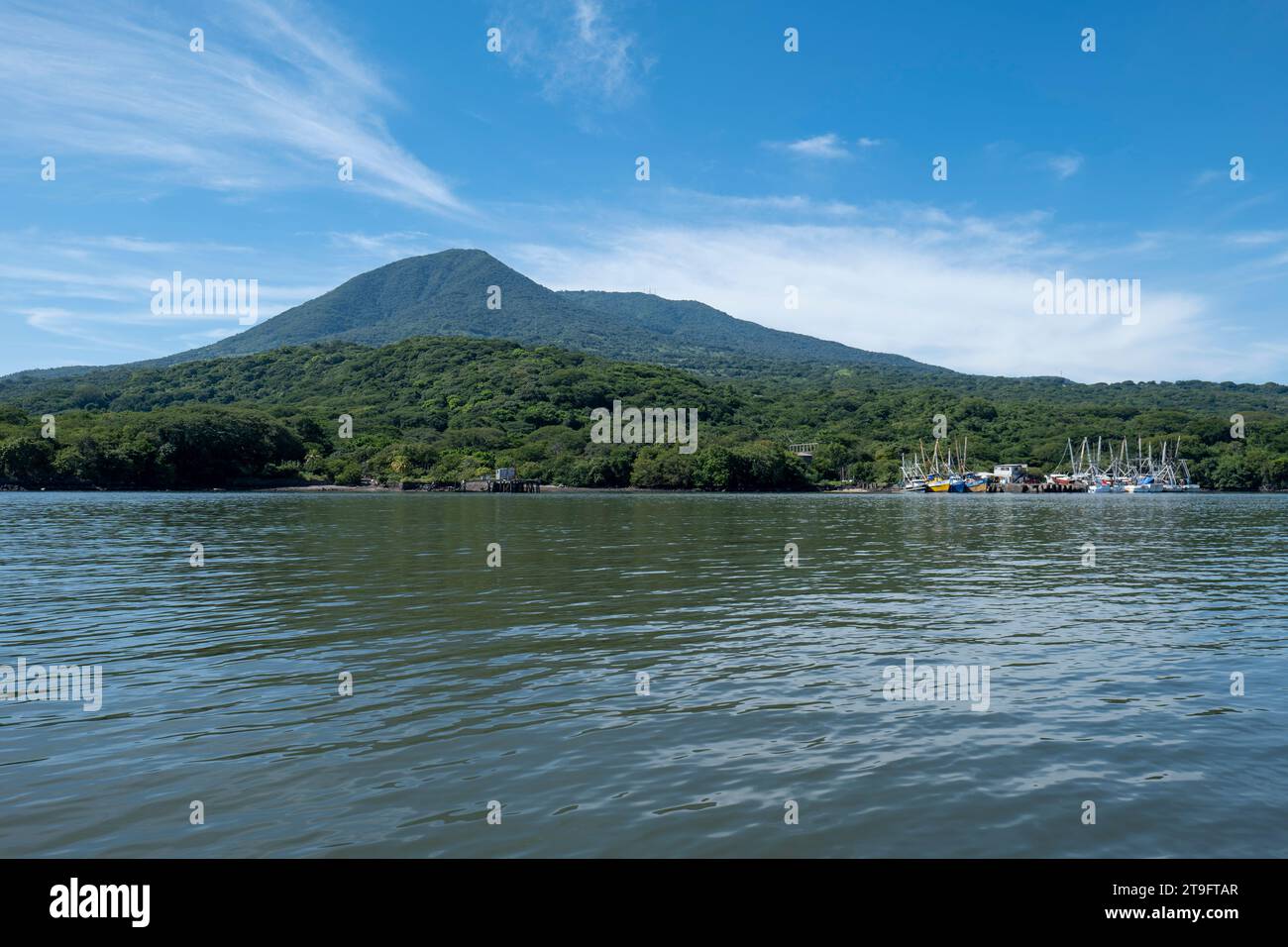 Coastline Seen From Afar with a Volcanic Mountain, Lush Vegetation ...