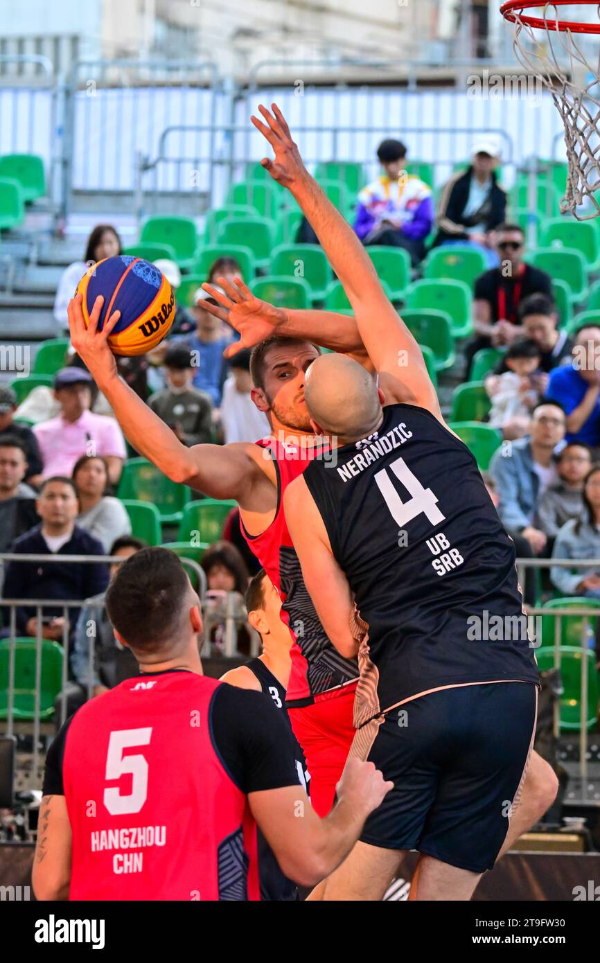 Hong Kong, China. 25th Nov, 2023. Goran Vidovic (top) of Hangzhou tries ...