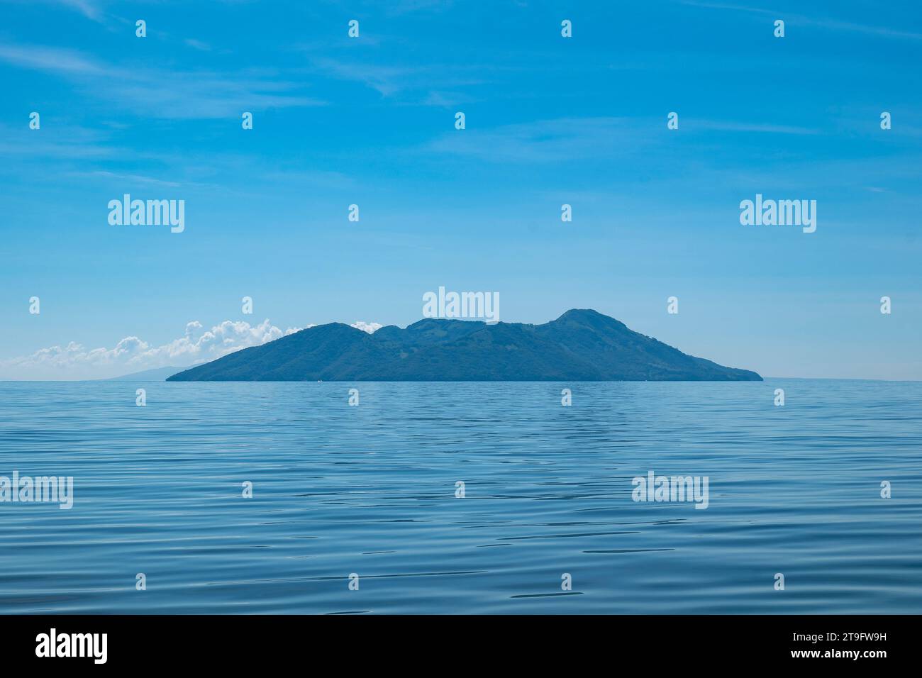 Island Seen From Afar with Volcanic Hills, Lush Vegetation Forest in ...