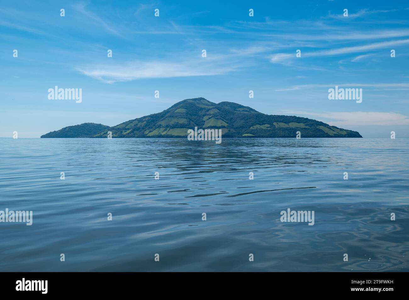 Island Seen From Afar with Volcanic Hills with Patches of Deforestation ...