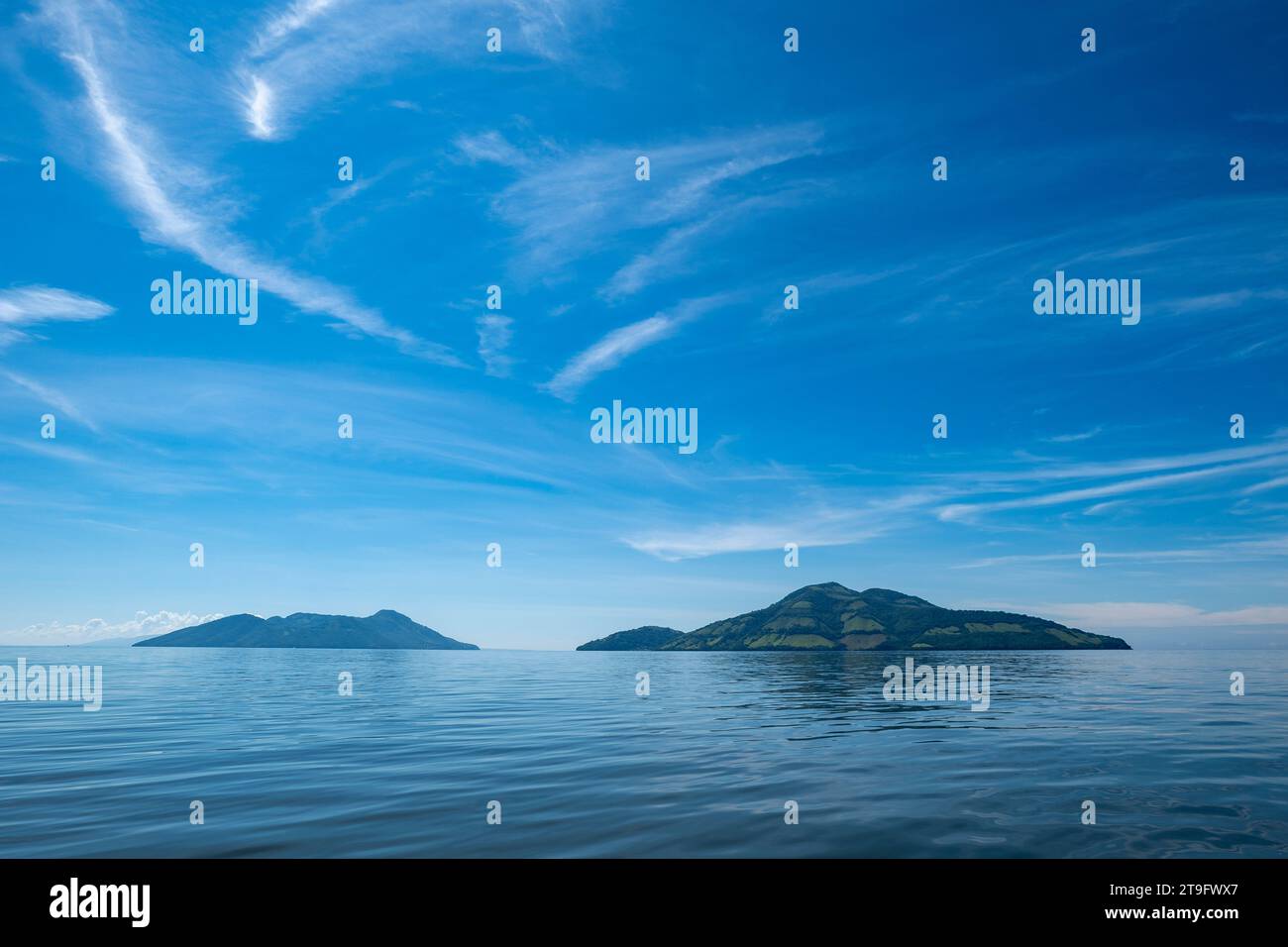 Tiny Islands Seen From Afar with Volcanic Mountains, Lush Vegetation ...