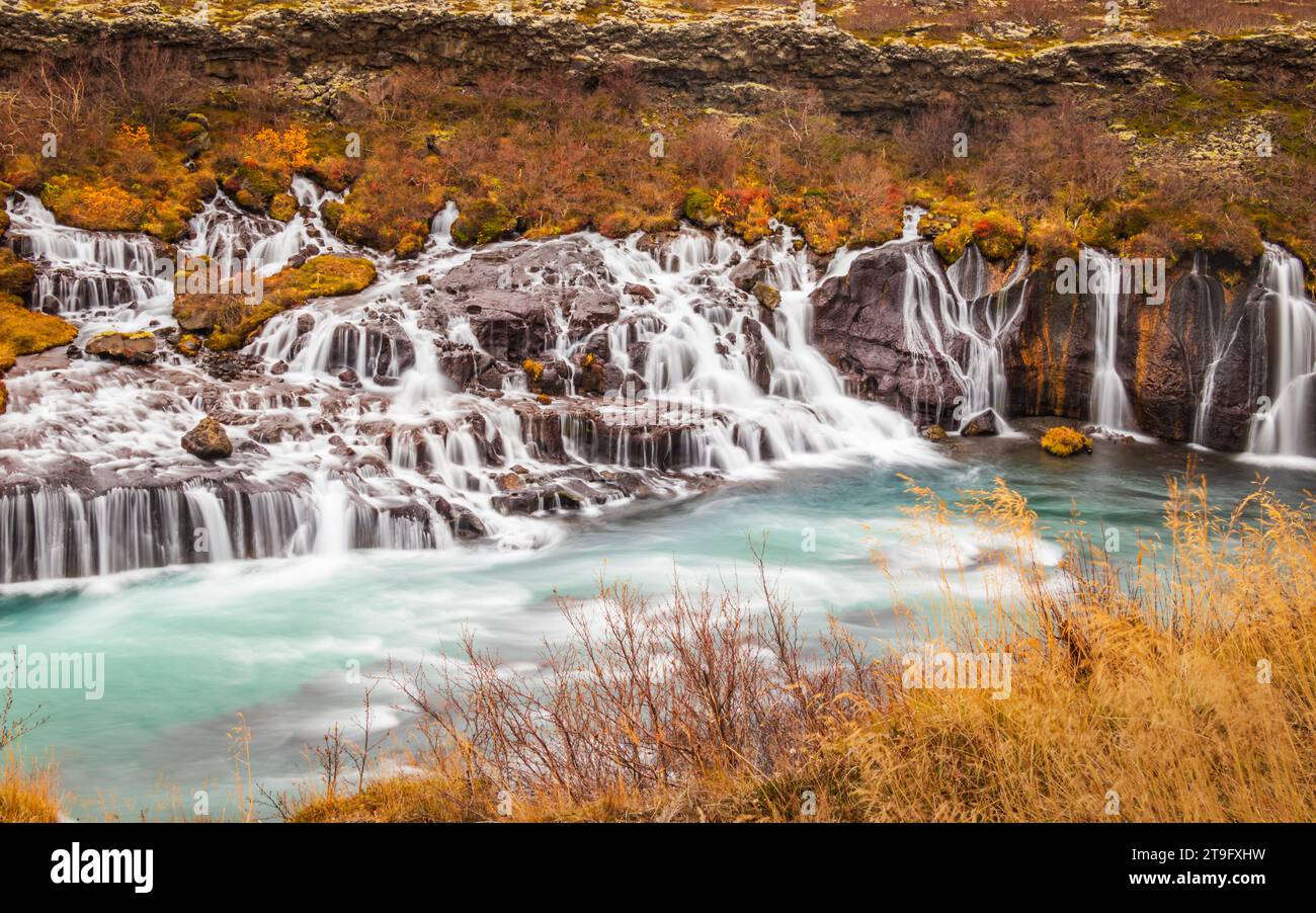 Hraunfossar waterfall in Autumn, is a series of waterfalls formed by ...