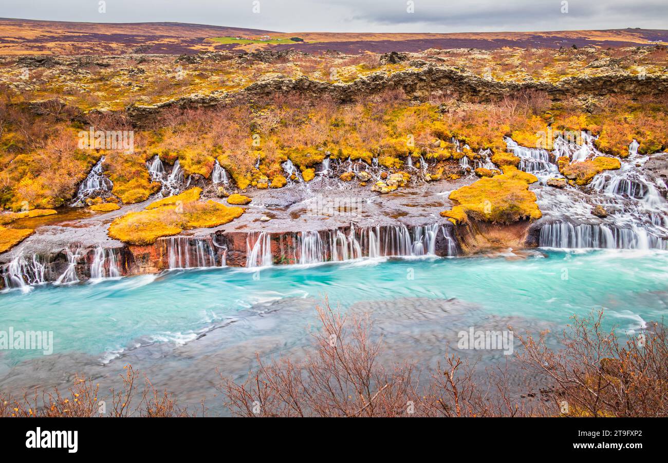 Hraunfossar waterfall in Autumn, is a series of waterfalls formed by ...