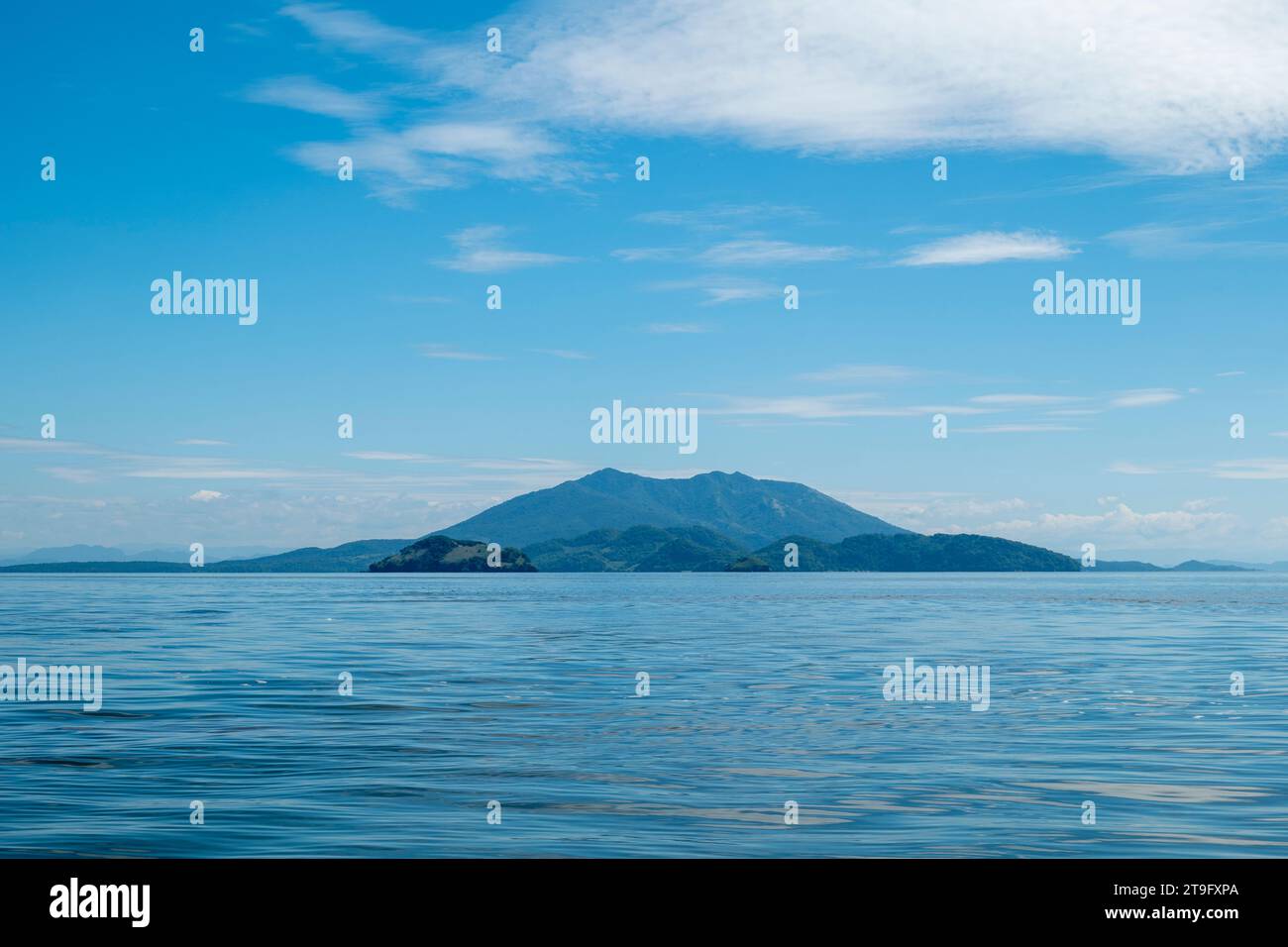 Tiny Islands Seen From Afar with Volcanic Mountains, Lush Vegetation ...