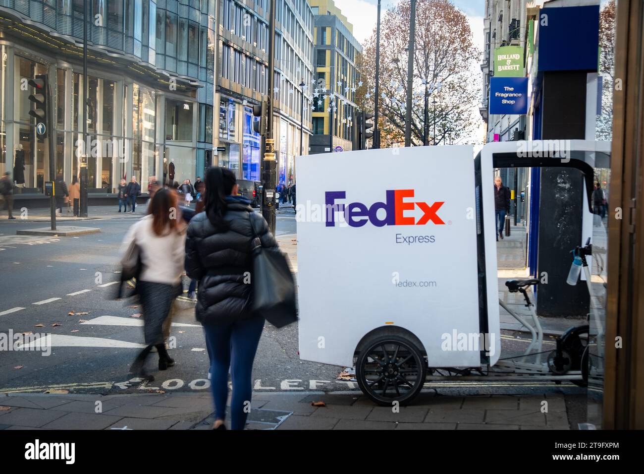 LONDON- NOVEMBER 23, 2023: Fedex Express pedal vehicle on Oxford Street in London's West End ...