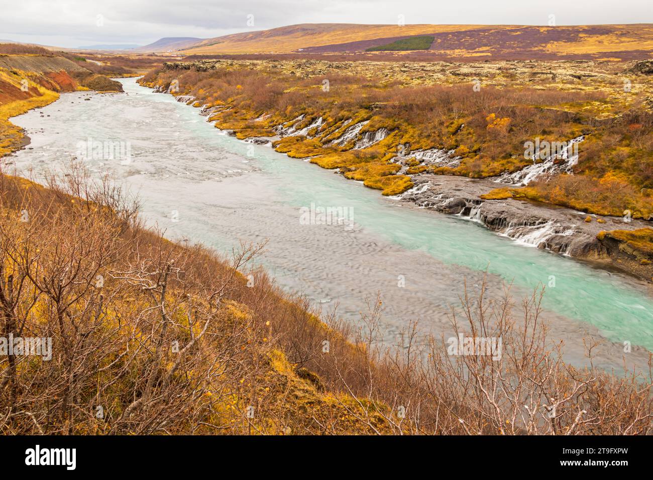 Hraunfossar waterfall in Autumn, is a series of waterfalls formed by ...