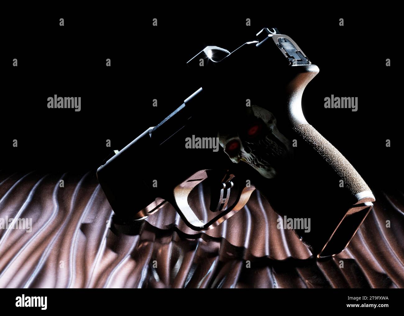 Human skull with glowing red eyes on the silhouette of a ghost gun ...