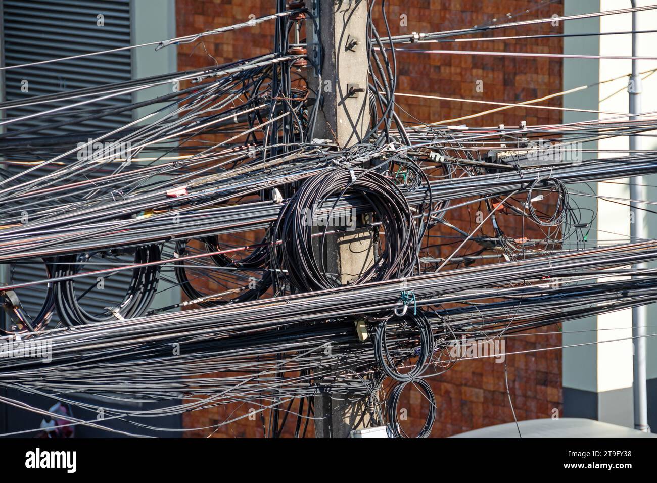 Electricity post with many wires and cables in wound various wires ...