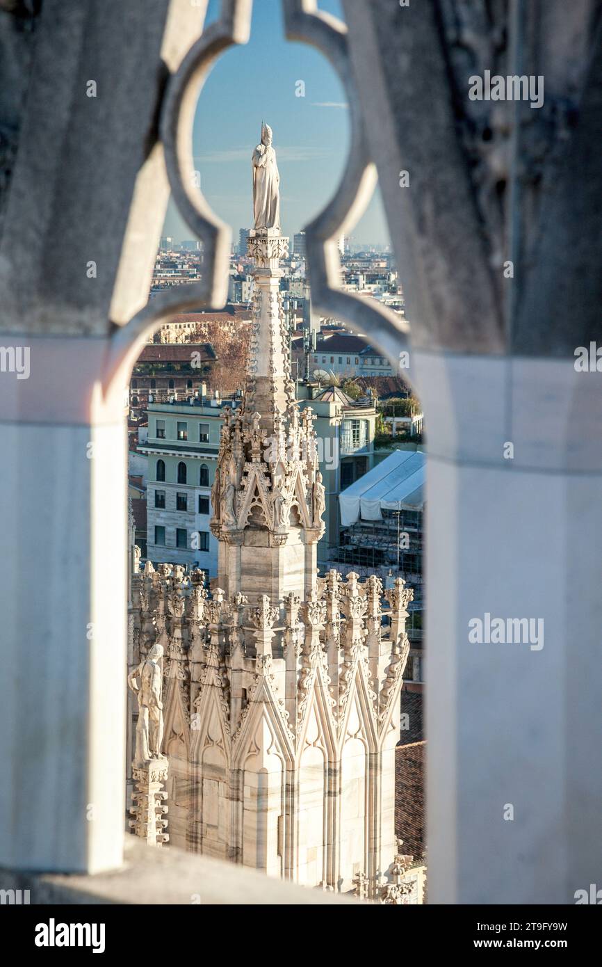 Detail from Milan Duomo rooftop, elaborate sculpture as seen framed by ...
