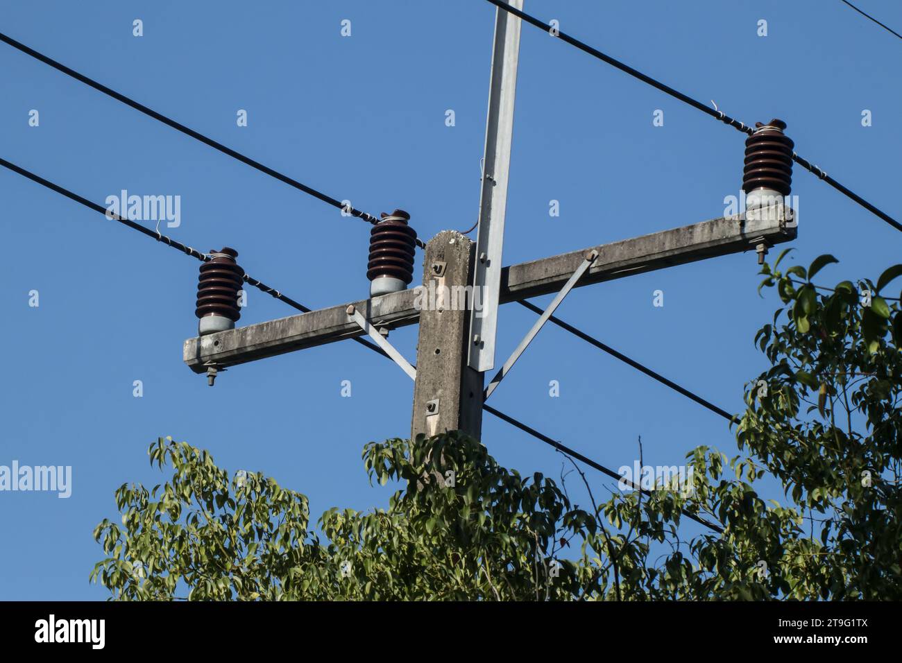 Closeup Eletricity line and electricity post wtih blue sky background ...