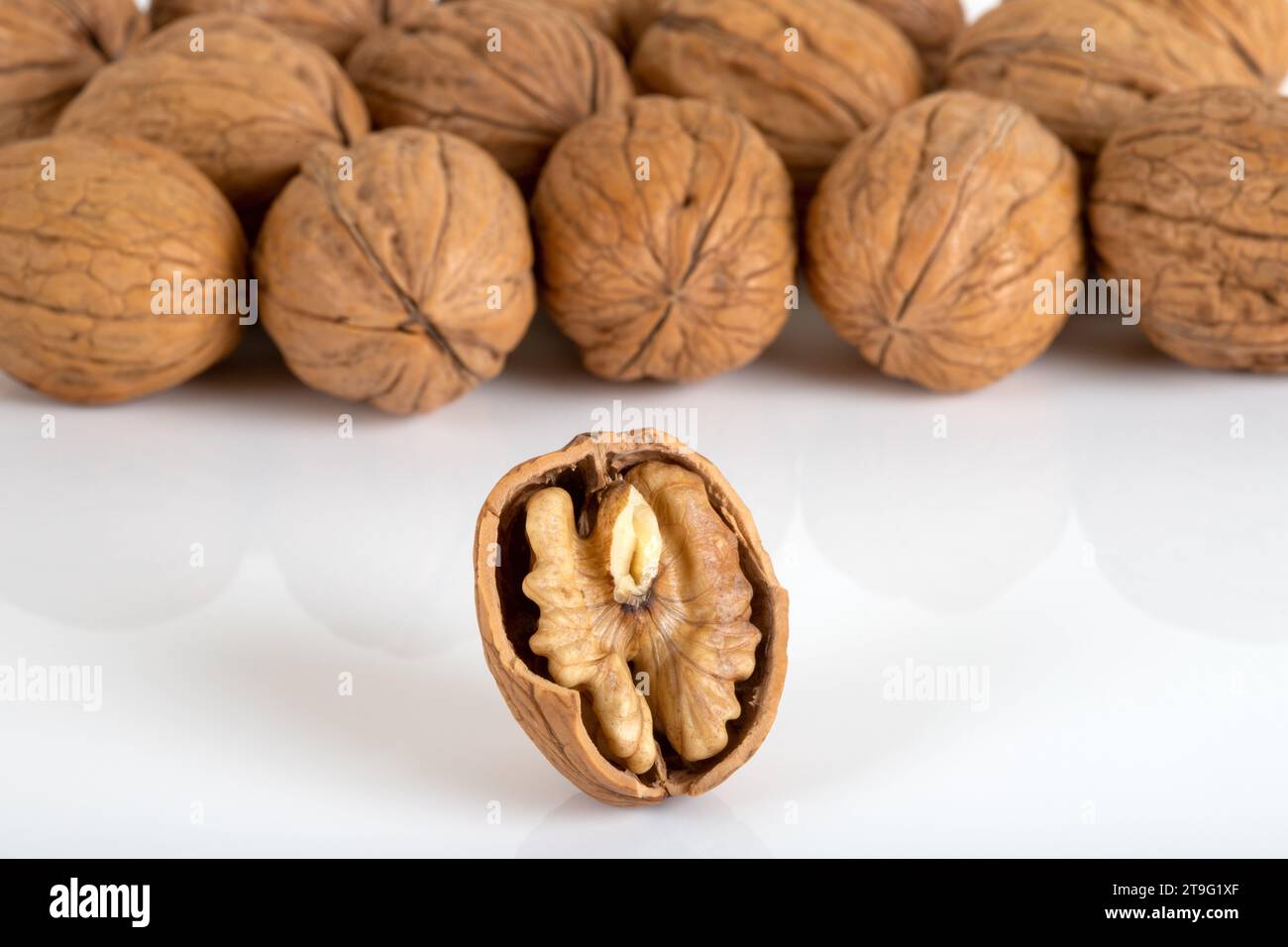Peeled and shelled walnuts on a white background Stock Photo - Alamy