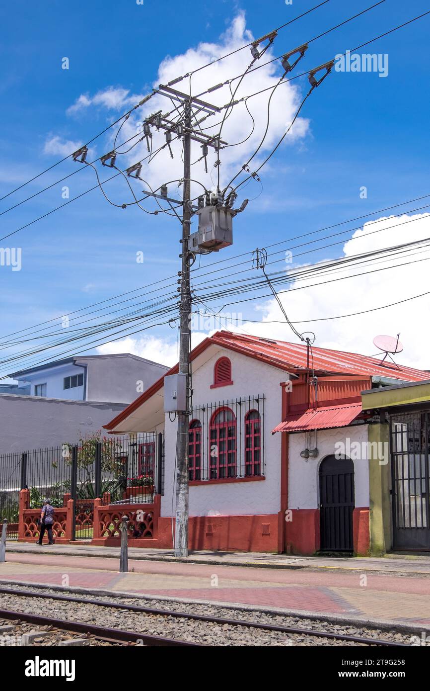 Scene with electricity pole and houses in the urban center of the city ...
