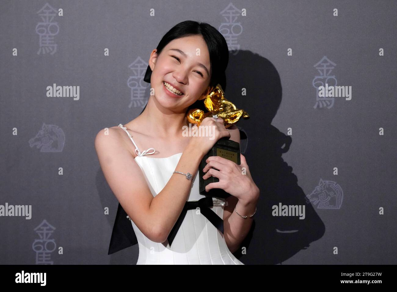 Taiwanese actress Audrey Lin holds her award for Best Leading Actress ...