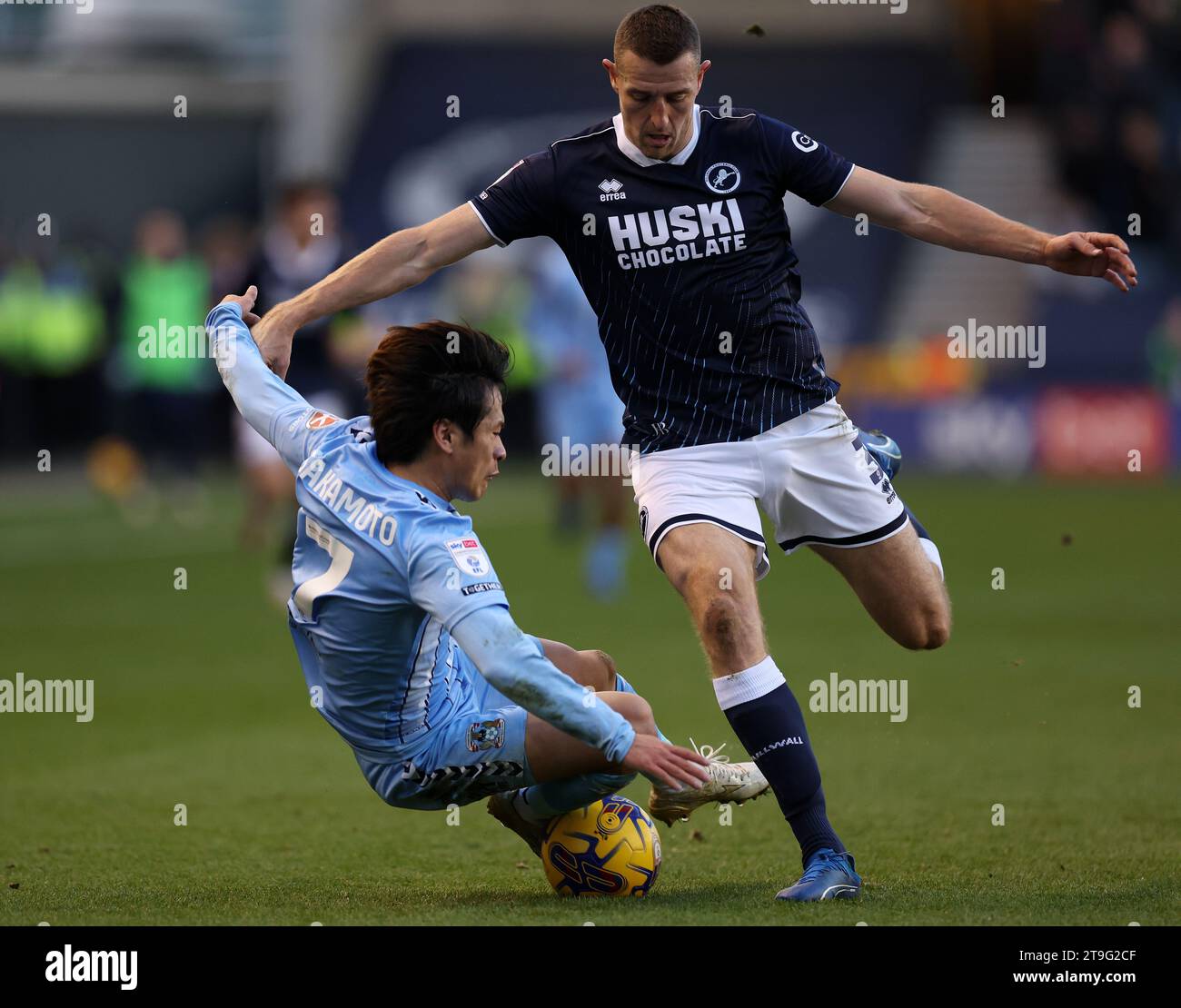 Coventry City's Tatsuhiro Sakamoto (left) and Millwall's Murray Wallace ...