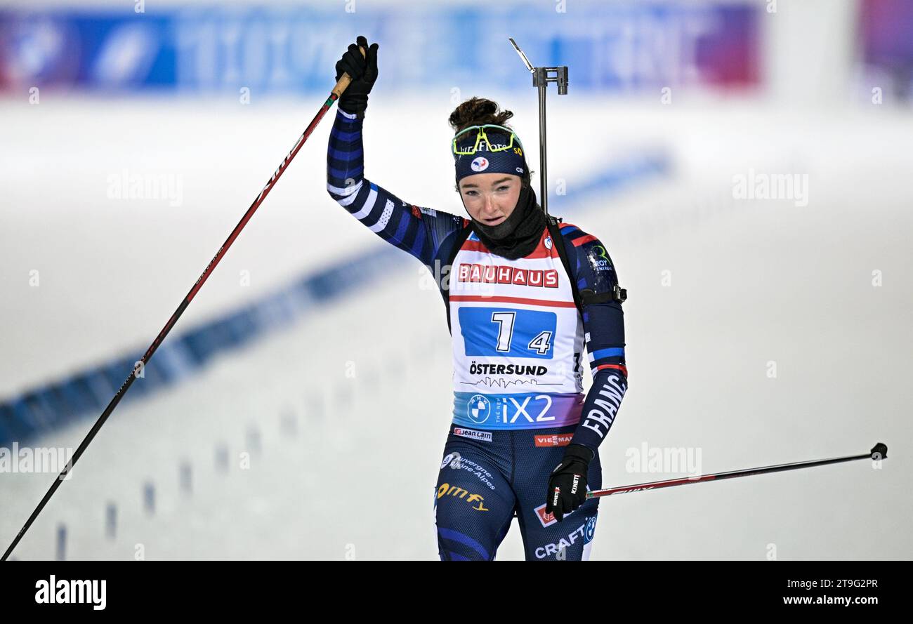 France's Lou Jeanmonnot crosses the finish line to win the Mixed Relay ...