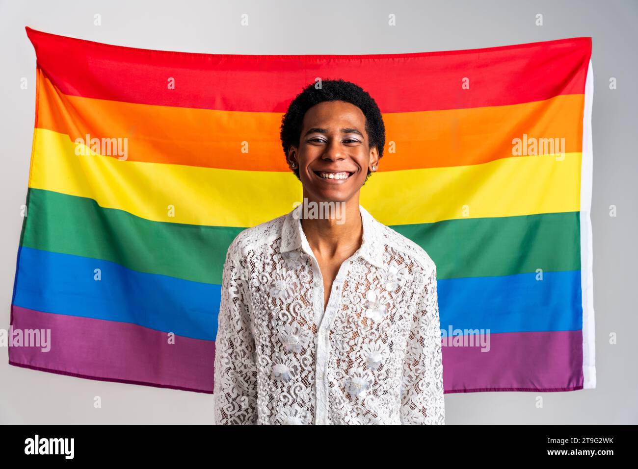 Fluid gender hispanic latin black man posing in studio with fashionable ...
