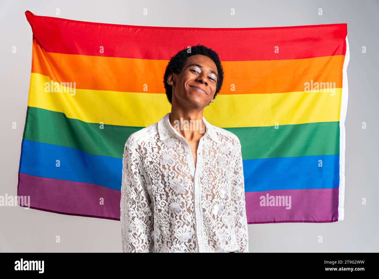 Fluid gender hispanic latin black man posing in studio with fashionable ...