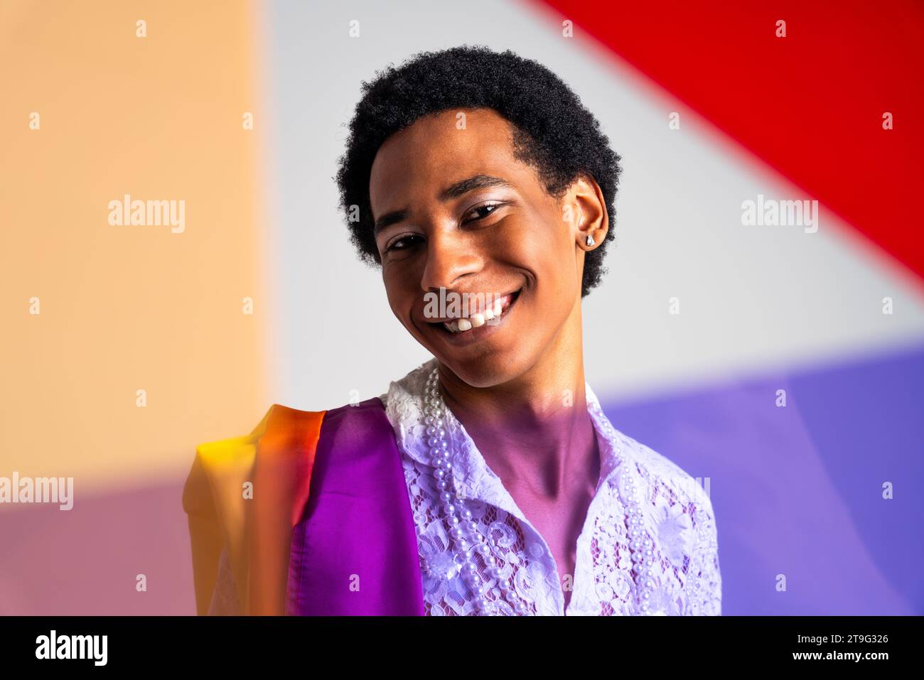 Fluid gender hispanic latin black man posing in studio with fashionable ...