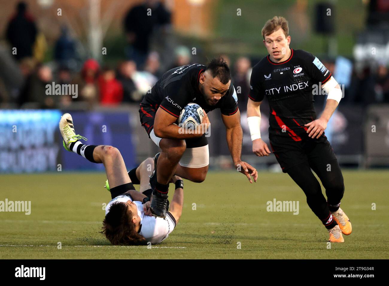 Saracens' Billy Vunipola (centre) is tackled by Bristol's Benhard Janse ...