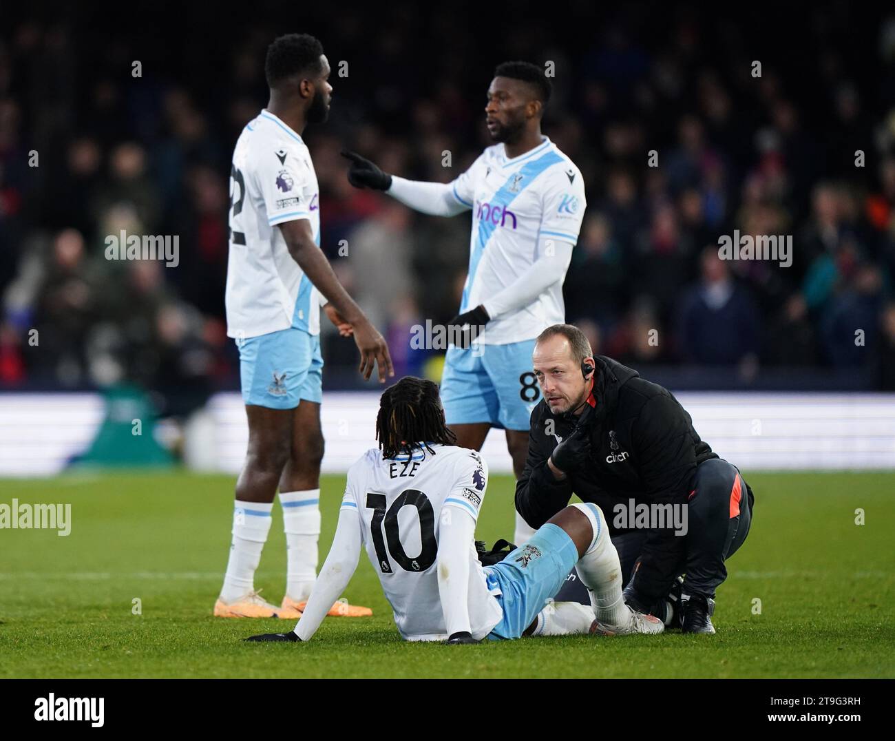 Crystal Palace's Eberechi Eze is assessed before leaving the game with ...