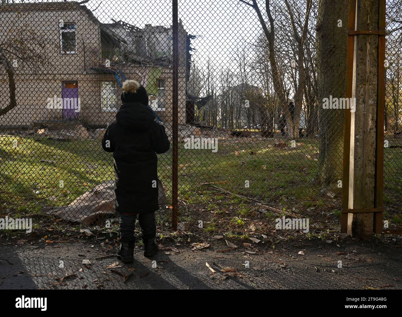 Kyiv, Ukraine. 25th Nov, 2023. A man looks at kindergarten school that ...