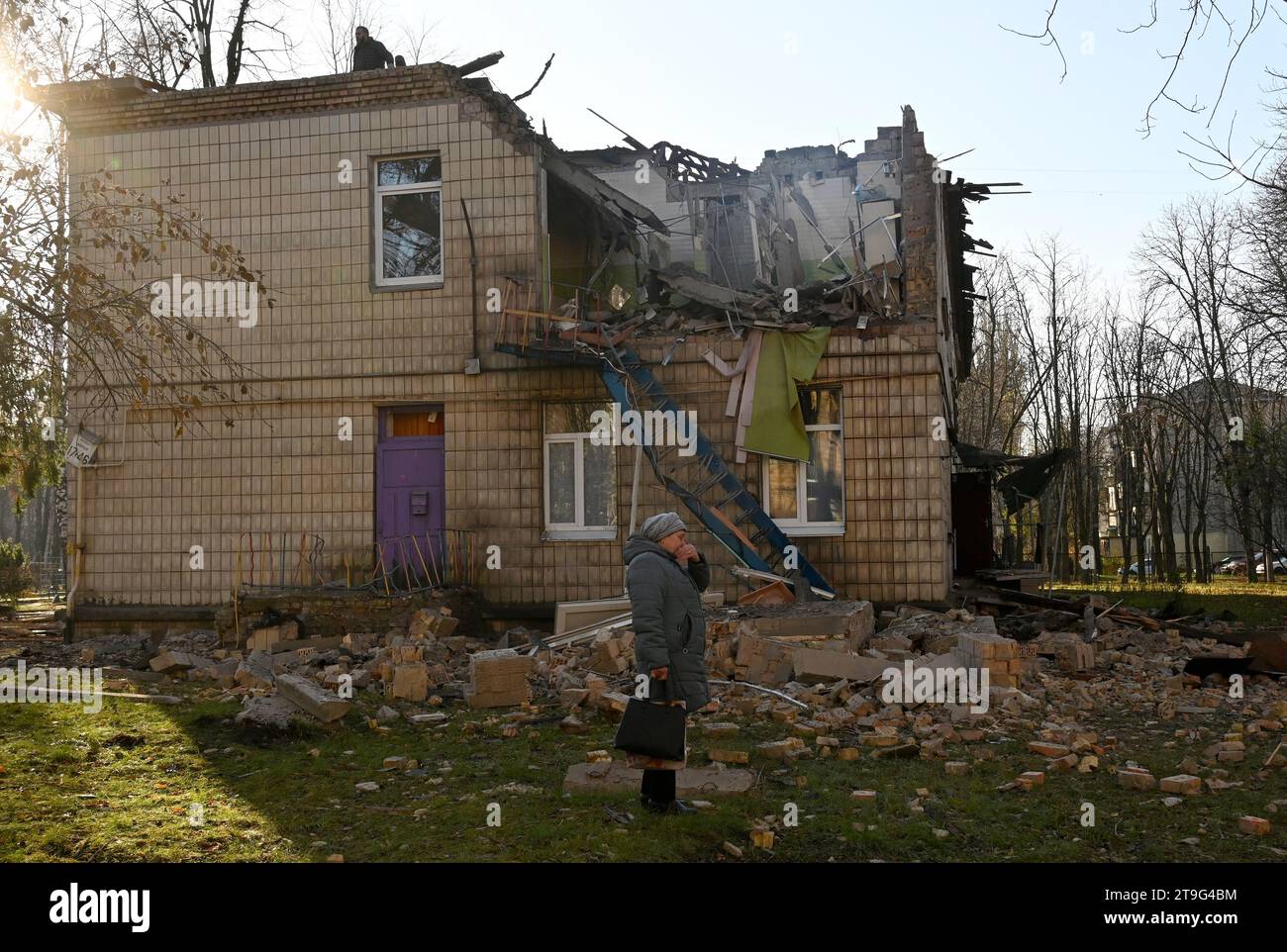 Kyiv, Ukraine. 25th Nov, 2023. A woman examines the kindergarten ...